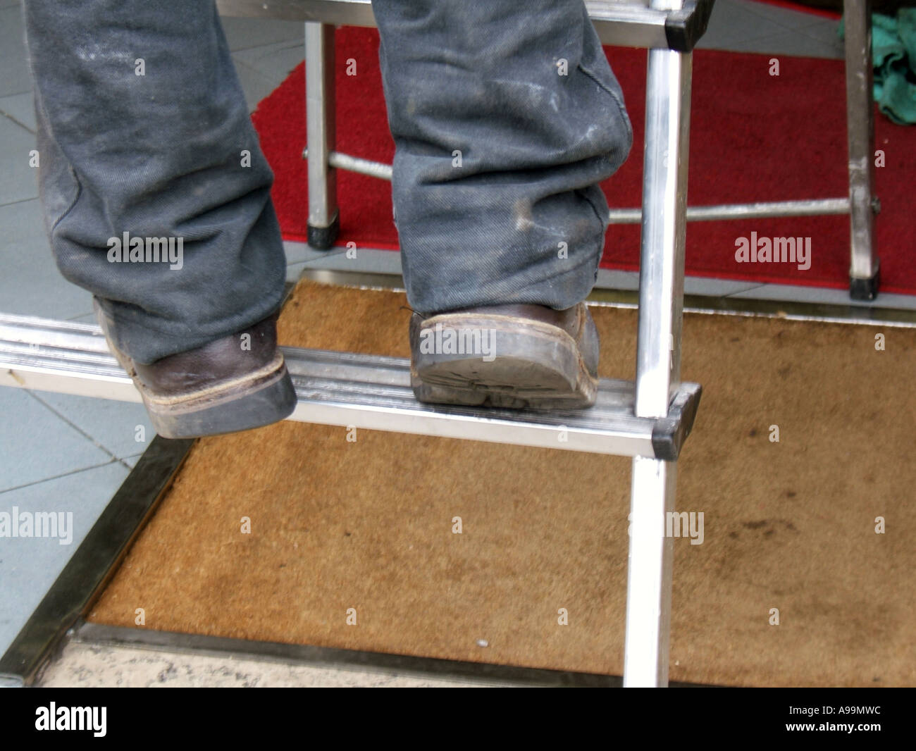Standing on ladder feet hi-res stock photography and images - Alamy