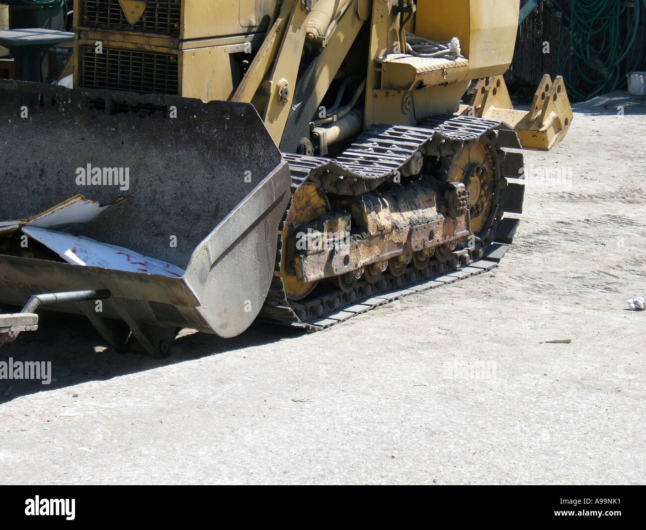 excavator digging into ground on building site Stock Photo - Alamy
