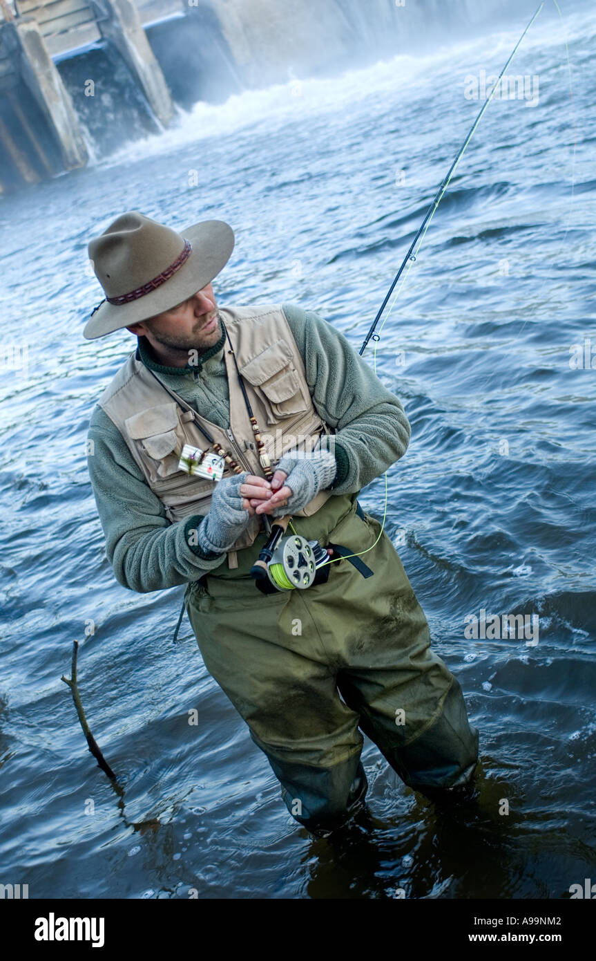 Man fly fishing in a river Stock Photo - Alamy