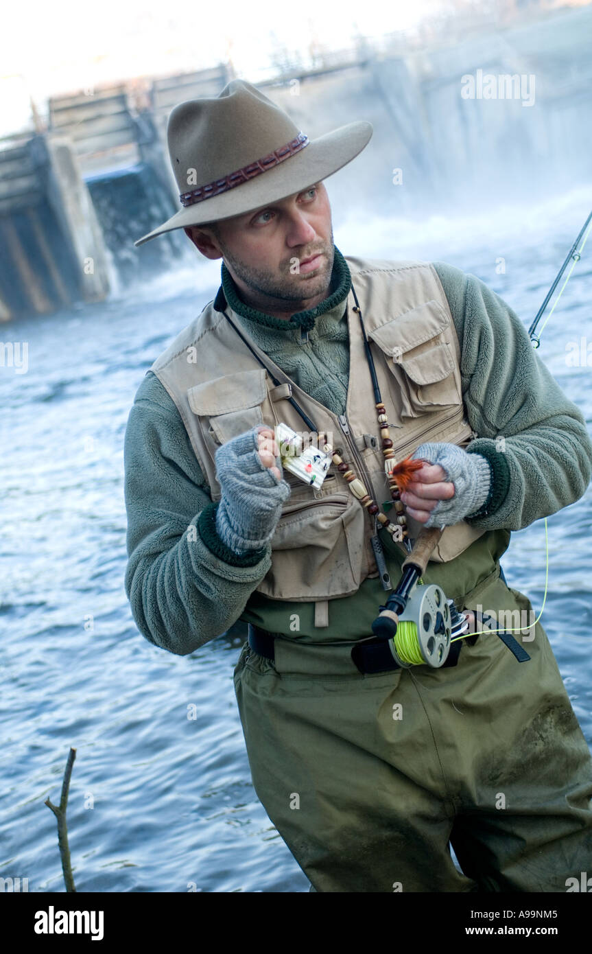 Man fly fishing in a river Stock Photo - Alamy