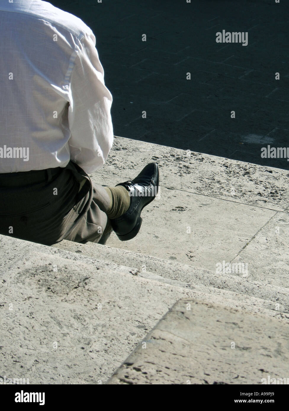 man sitting on steps Stock Photo - Alamy