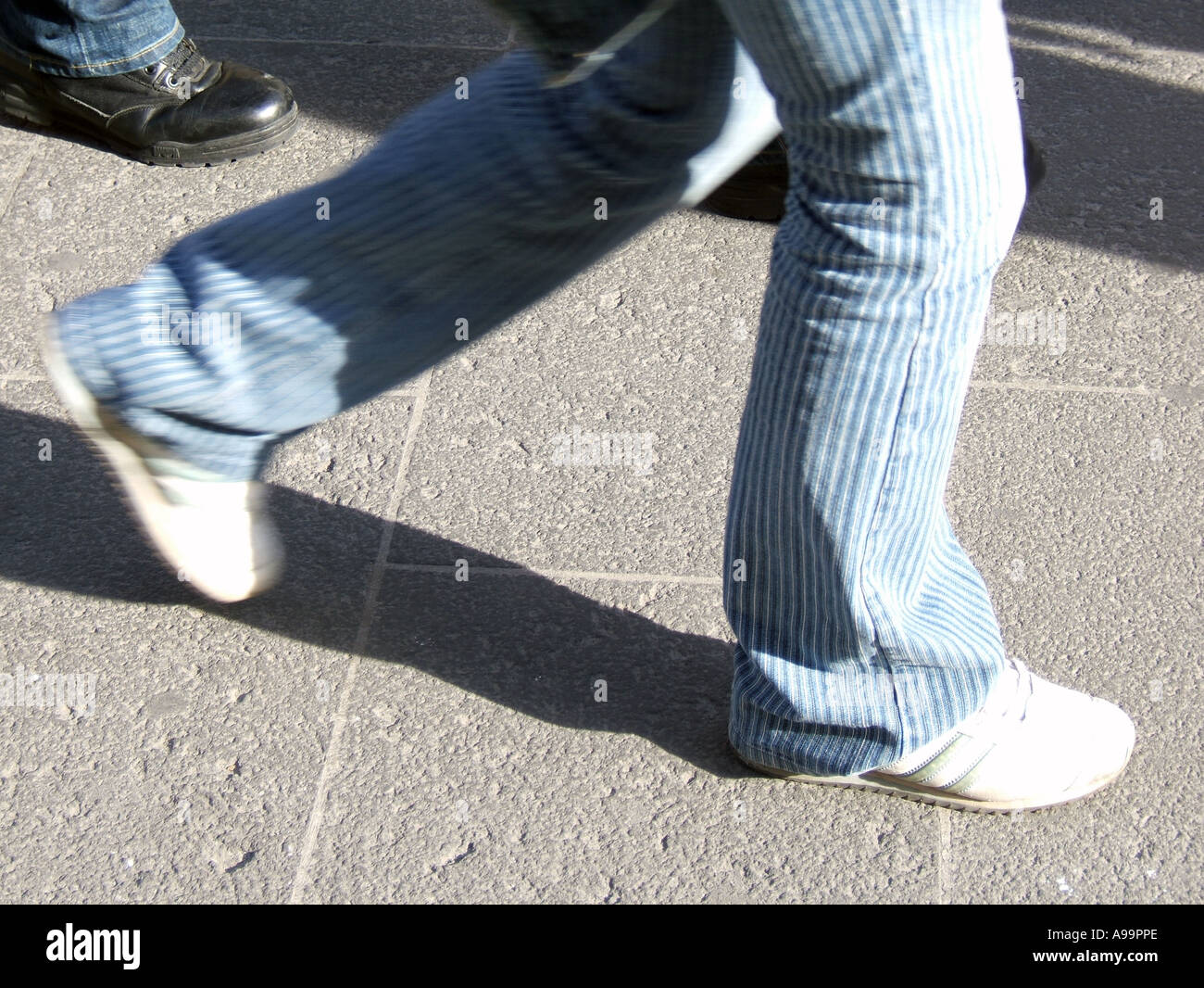 people walking on sidewalk Stock Photo - Alamy
