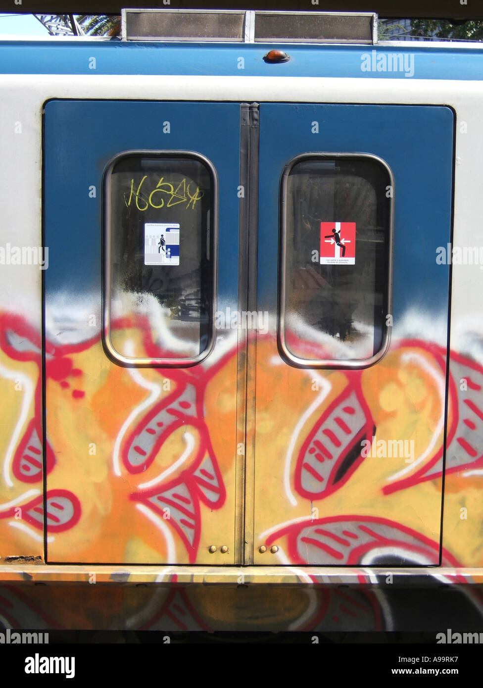 train carriage and doors covered with graffiti Stock Photo - Alamy