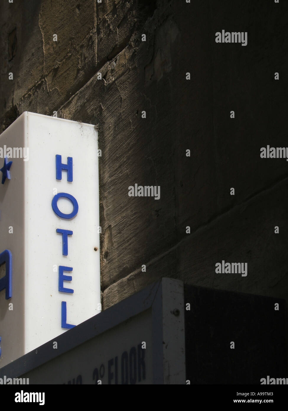 dark hotel sign on wall Stock Photo - Alamy