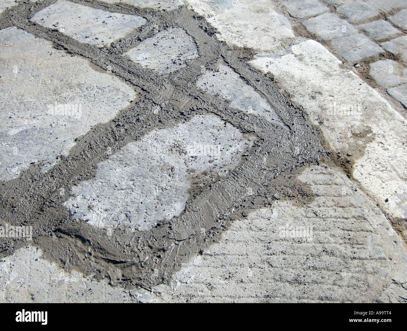 pavement repairs with fresh cement Stock Photo - Alamy
