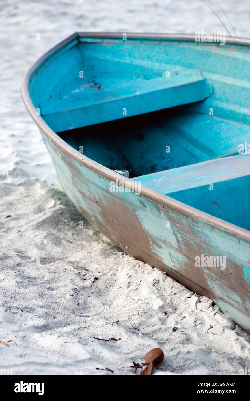 Empty boat rests on beach Stock Photo - Alamy