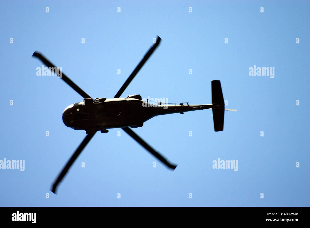 Military helicopter flying overhead Stock Photo - Alamy