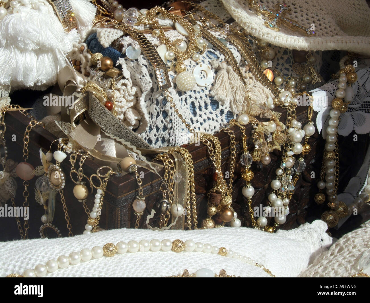 treasure chest full of gems and jewellery in shop window Stock Photo ...