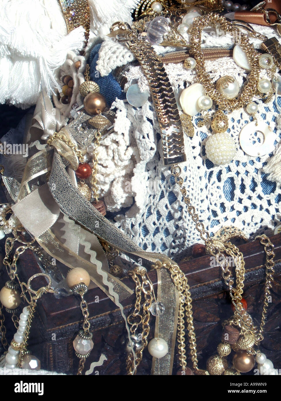 treasure chest full of gems and jewellery in shop window Stock Photo ...