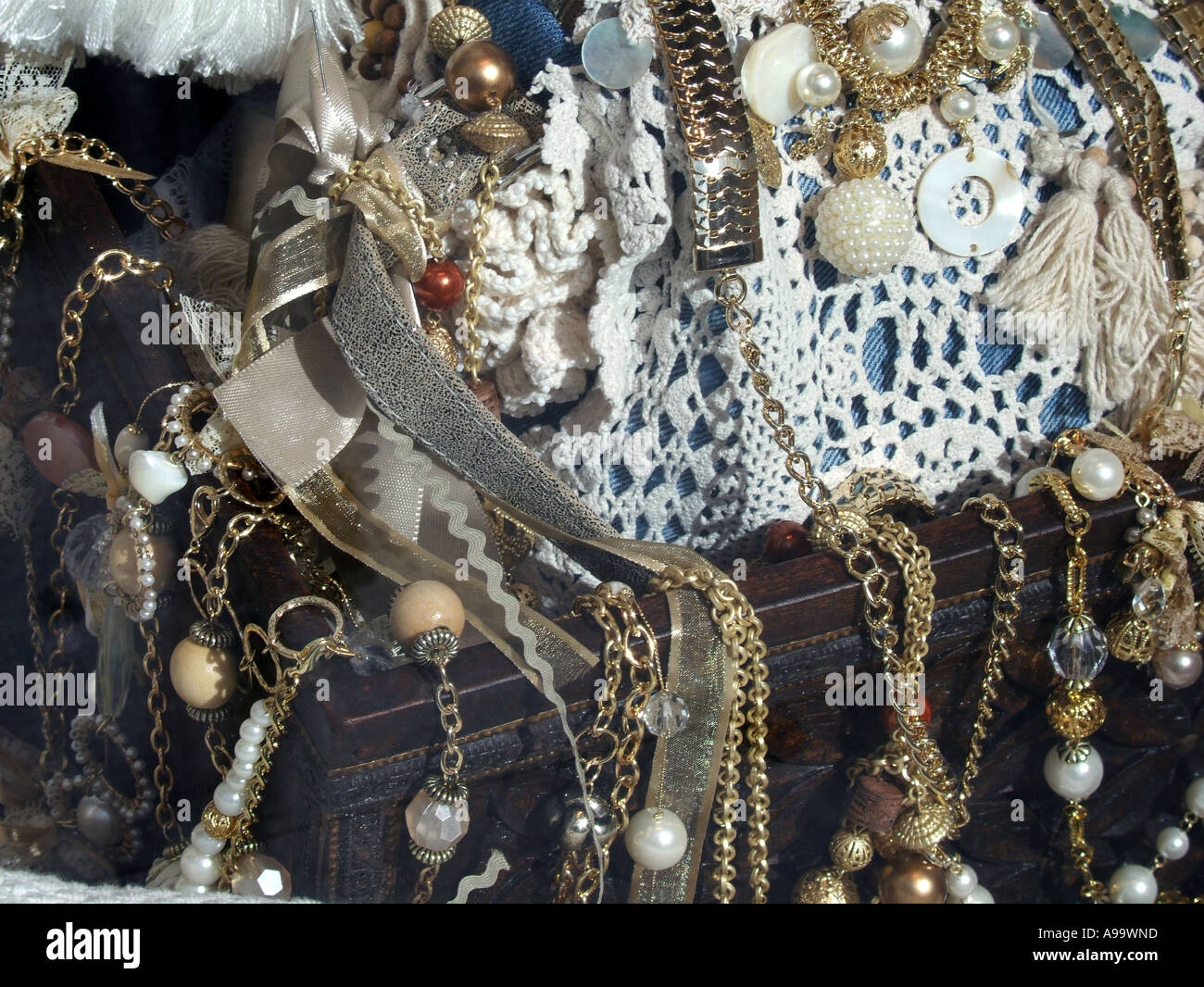 treasure chest full of gems and jewellery in shop window Stock Photo ...