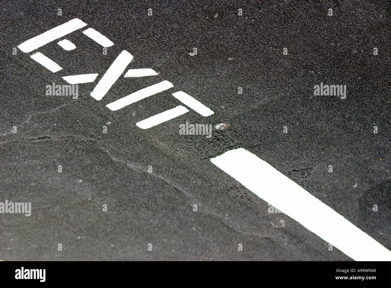 Exit and directional line painted on surface Stock Photo - Alamy
