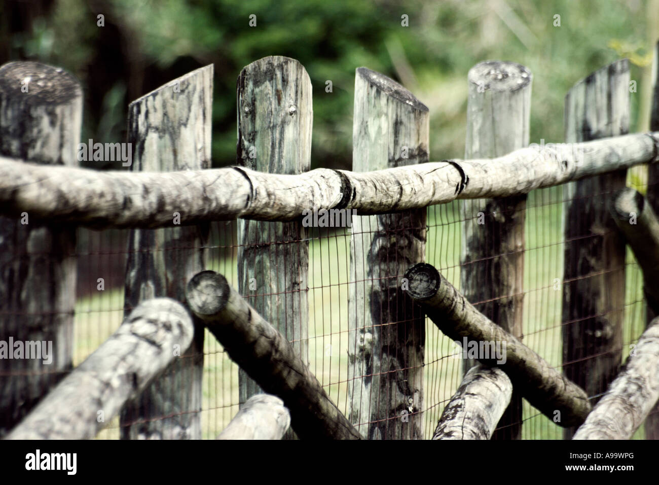 Log and wire fence Stock Photo - Alamy