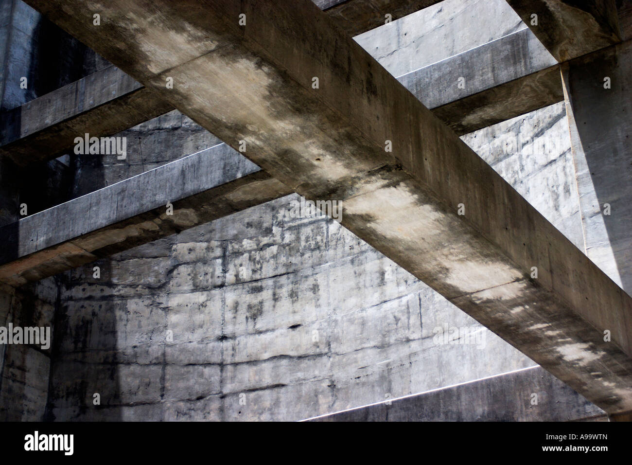 Support beams stretch across concrete structure Stock Photo - Alamy