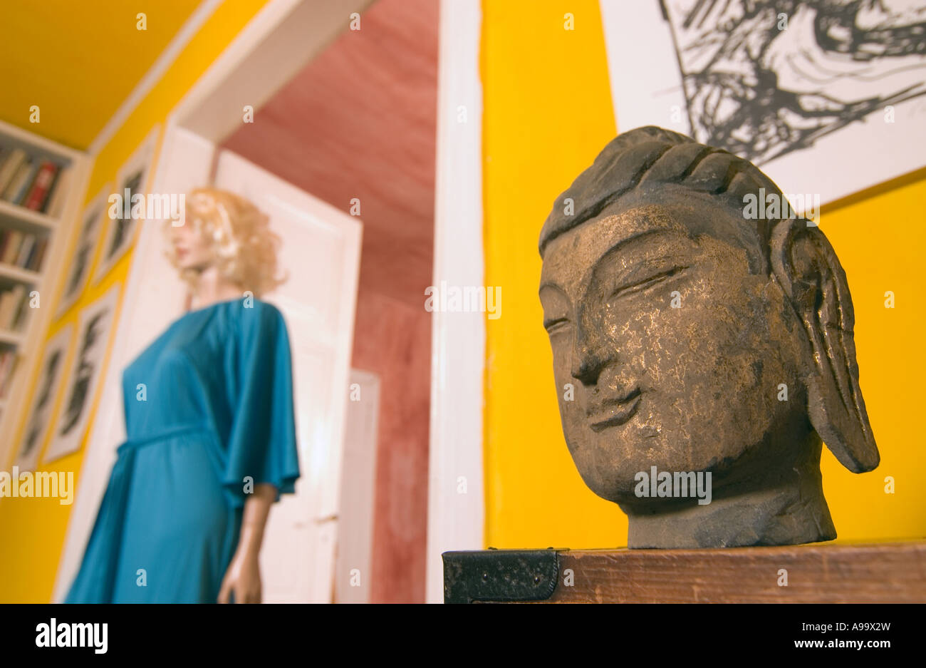 Blonde window dummy in a colourful flat Stock Photo - Alamy