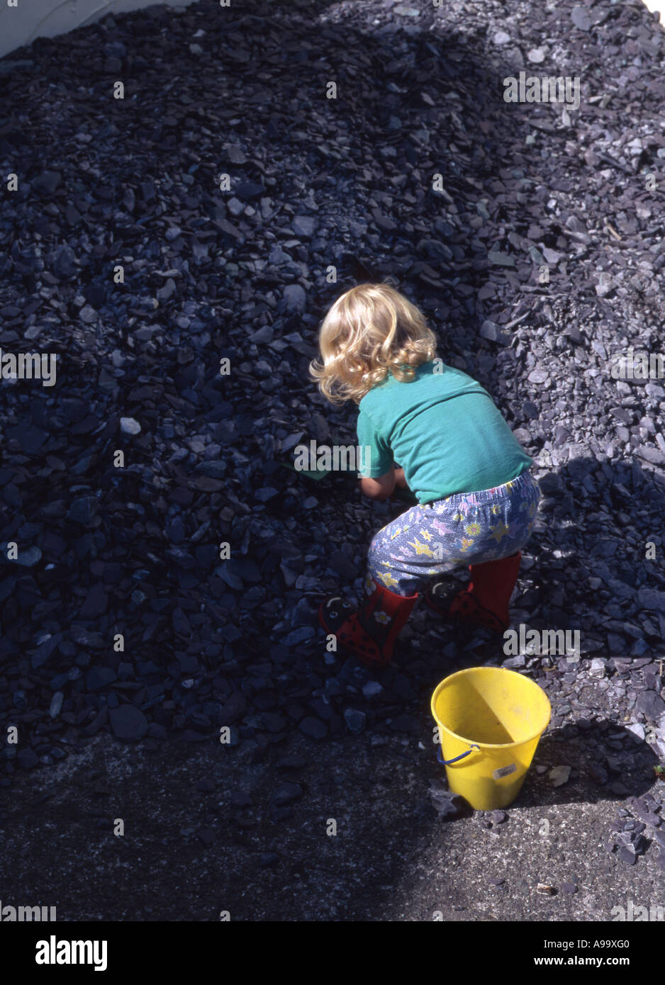 young baby girl digging Stock Photo - Alamy