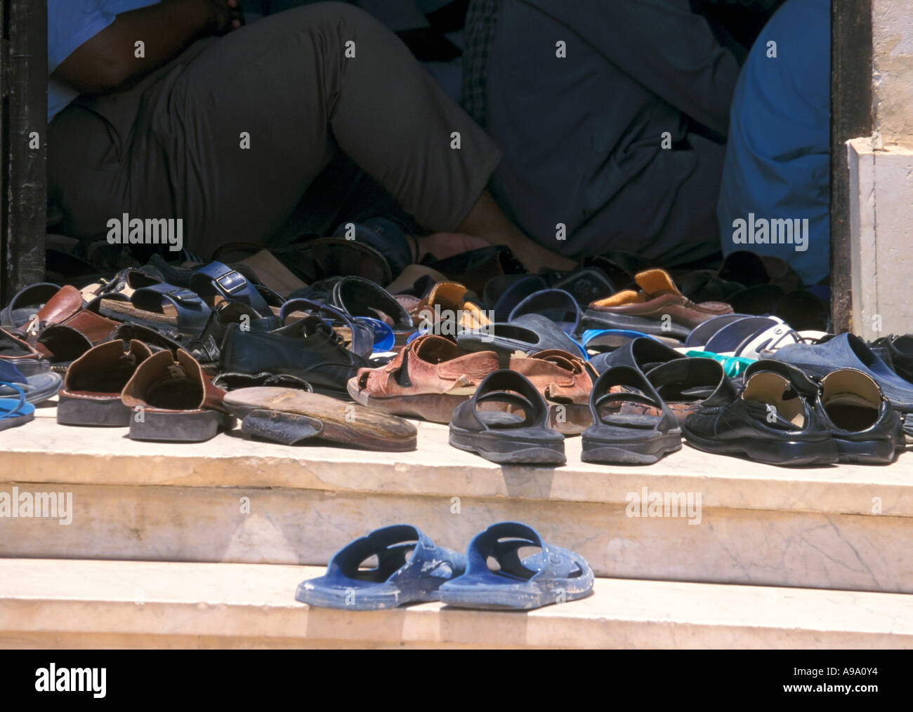 Prayers leaving shoes on floor in Hurgada Mosque Egypt Stock Photo - Alamy