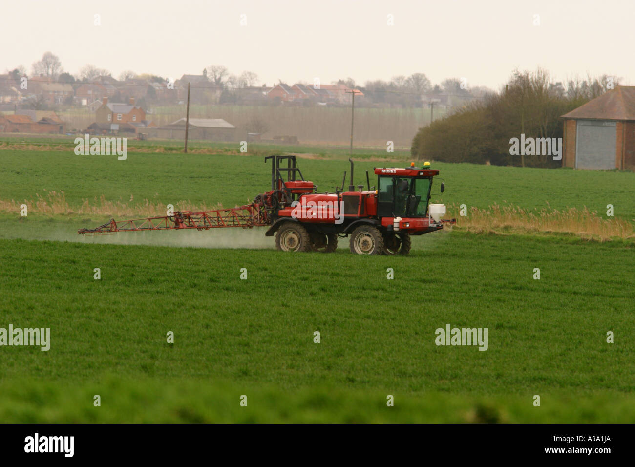 Agricultural vehicle crop spraying in Lincolnshire Stock Photo - Alamy