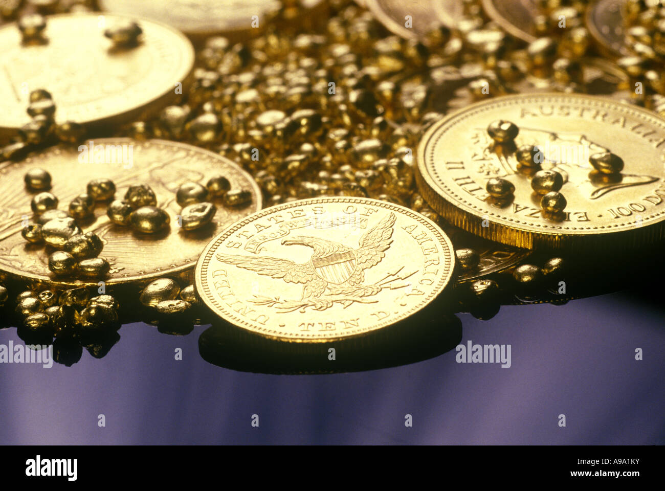 GOLD BULLION COINS AND GOLD SHOT Stock Photo - Alamy