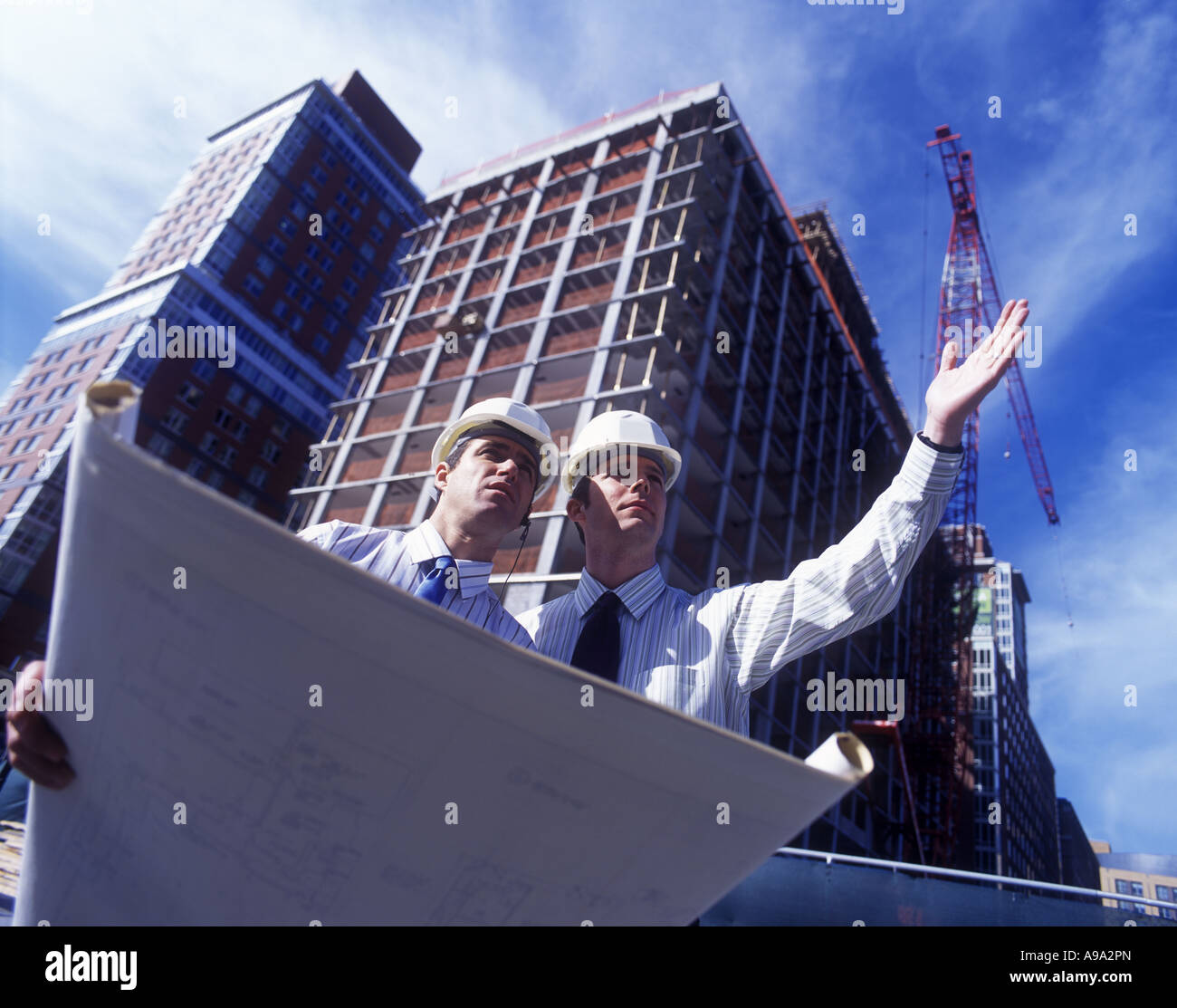 CONSTRUCTION MANAGERS AT BUILDING SITE Stock Photo - Alamy