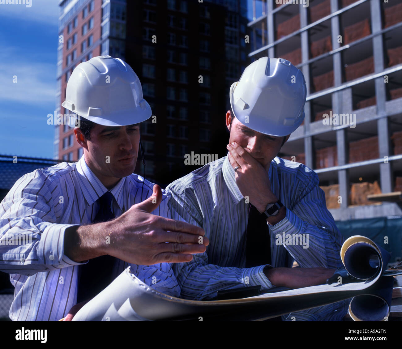 CONSTRUCTION MANAGERS AT BUILDING SITE Stock Photo - Alamy