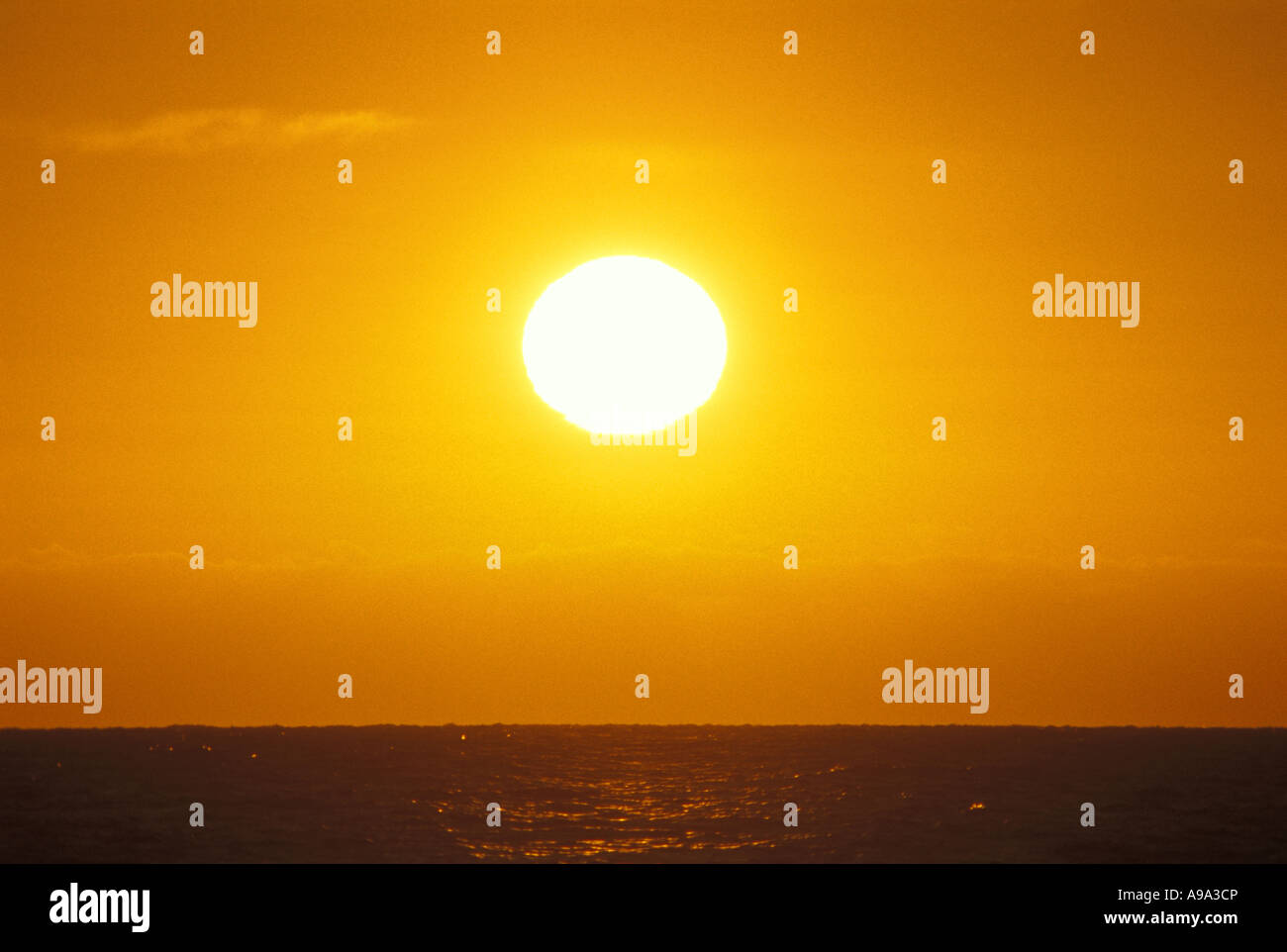 SUN OVER WATER Stock Photo - Alamy