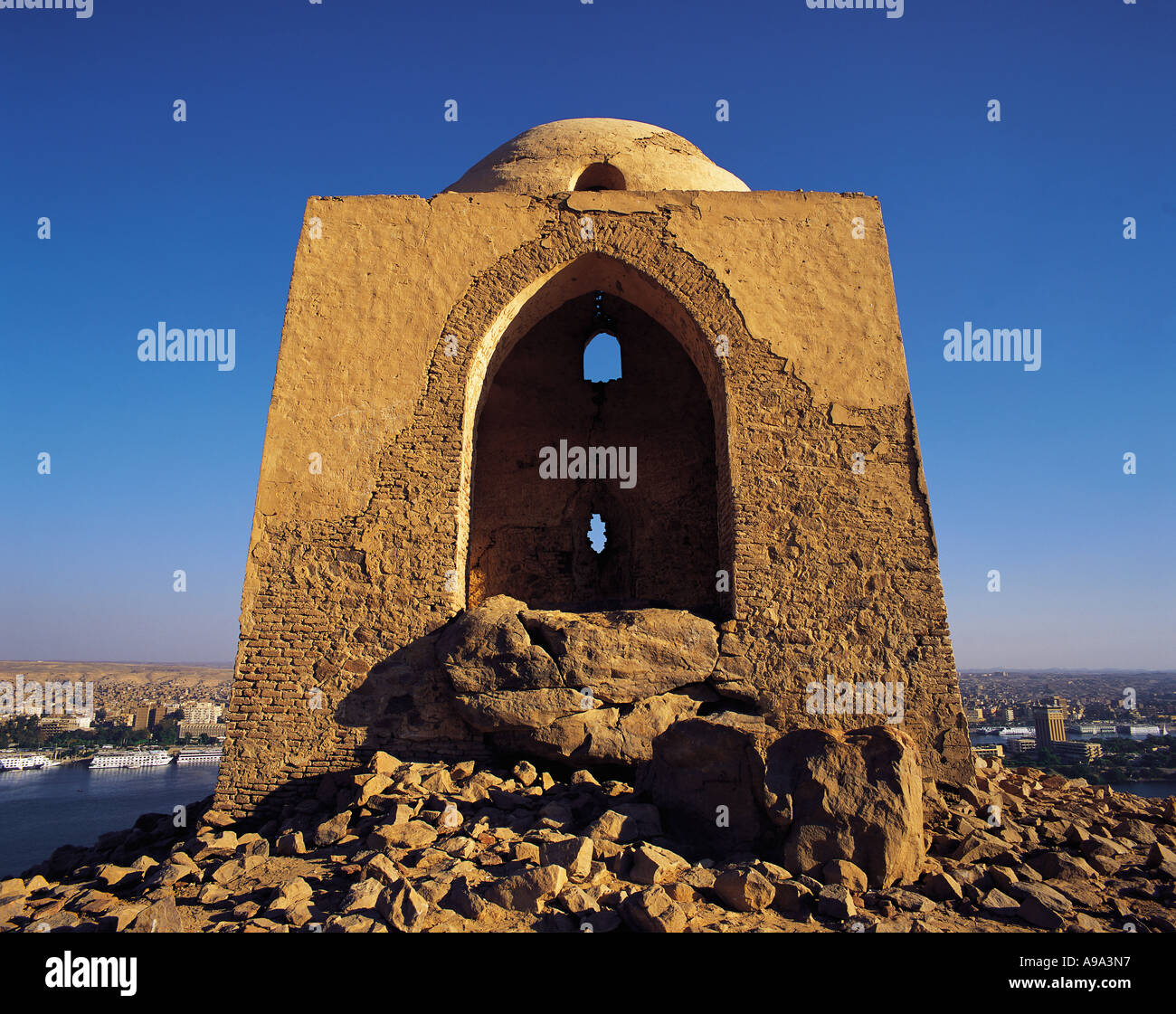 Simple Islamic memorial or shrine above the river Nile and the city of ...