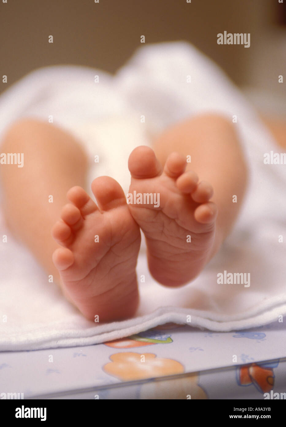 Infant boy feet Stock Photo - Alamy