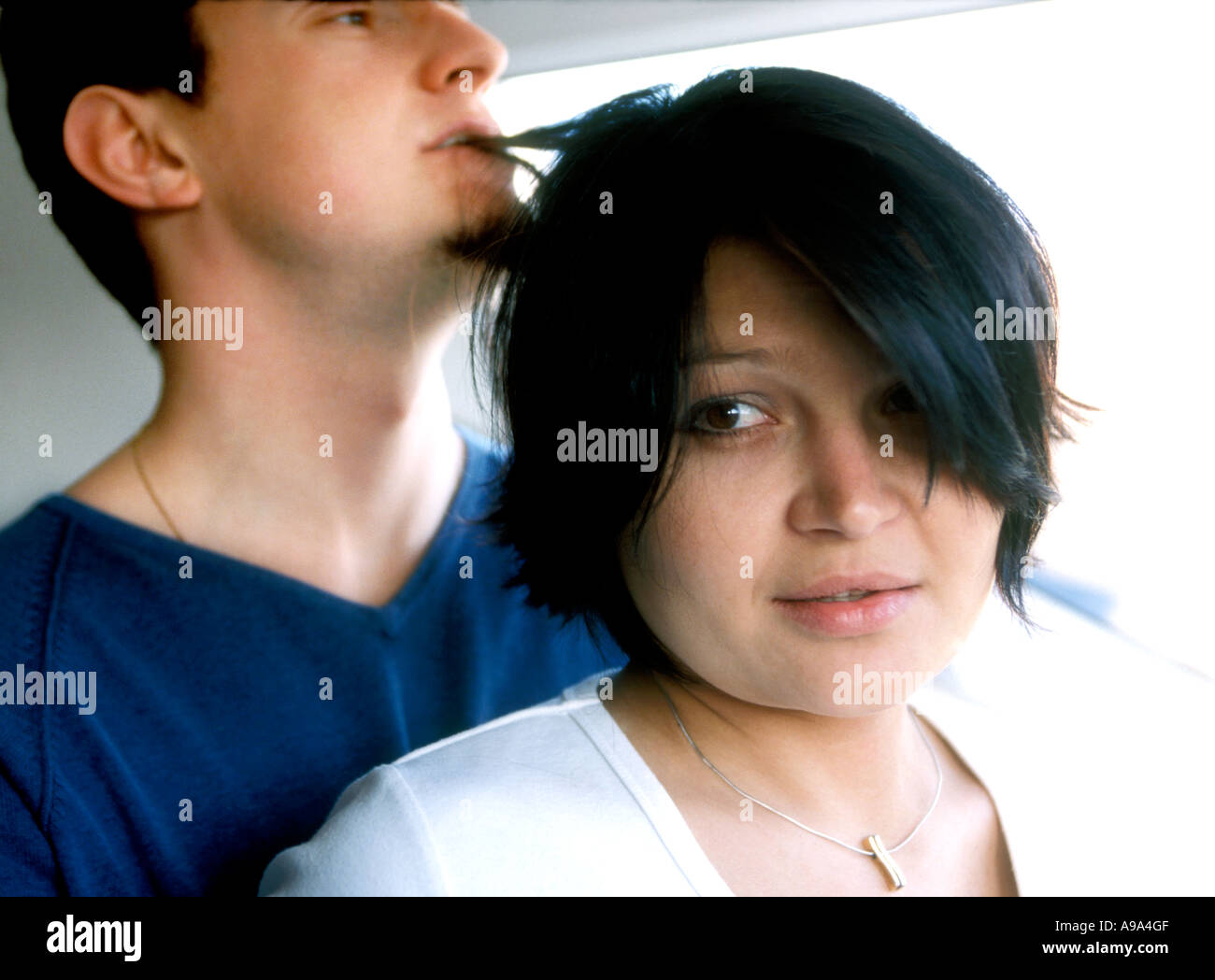 Married couple together Man biting woman hair Stock Photo - Alamy