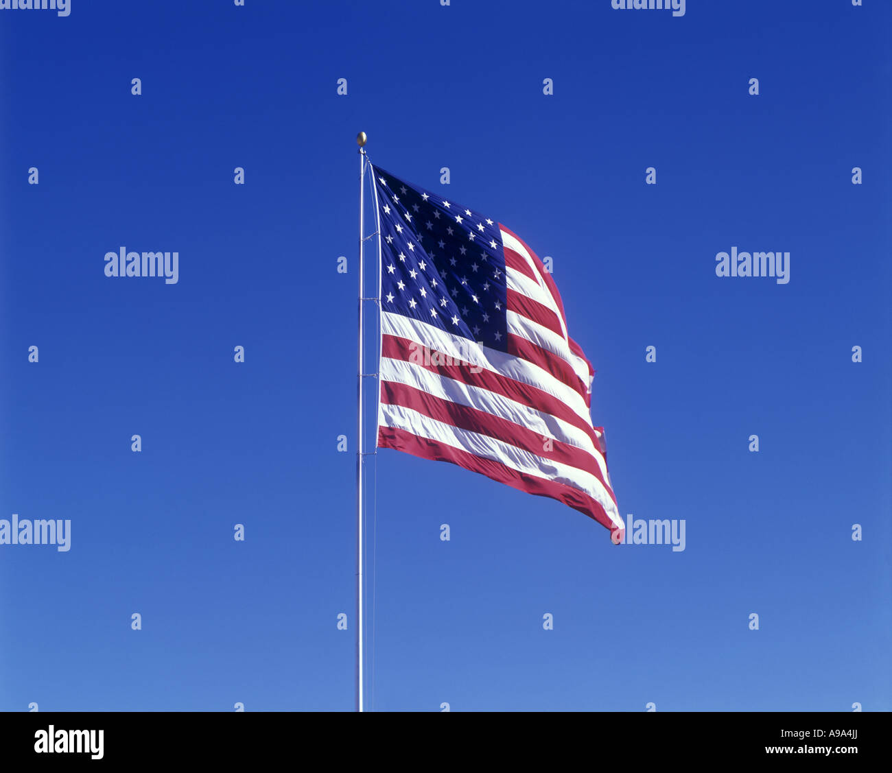 UNITED STATES FLAG BLUE SKY Stock Photo - Alamy