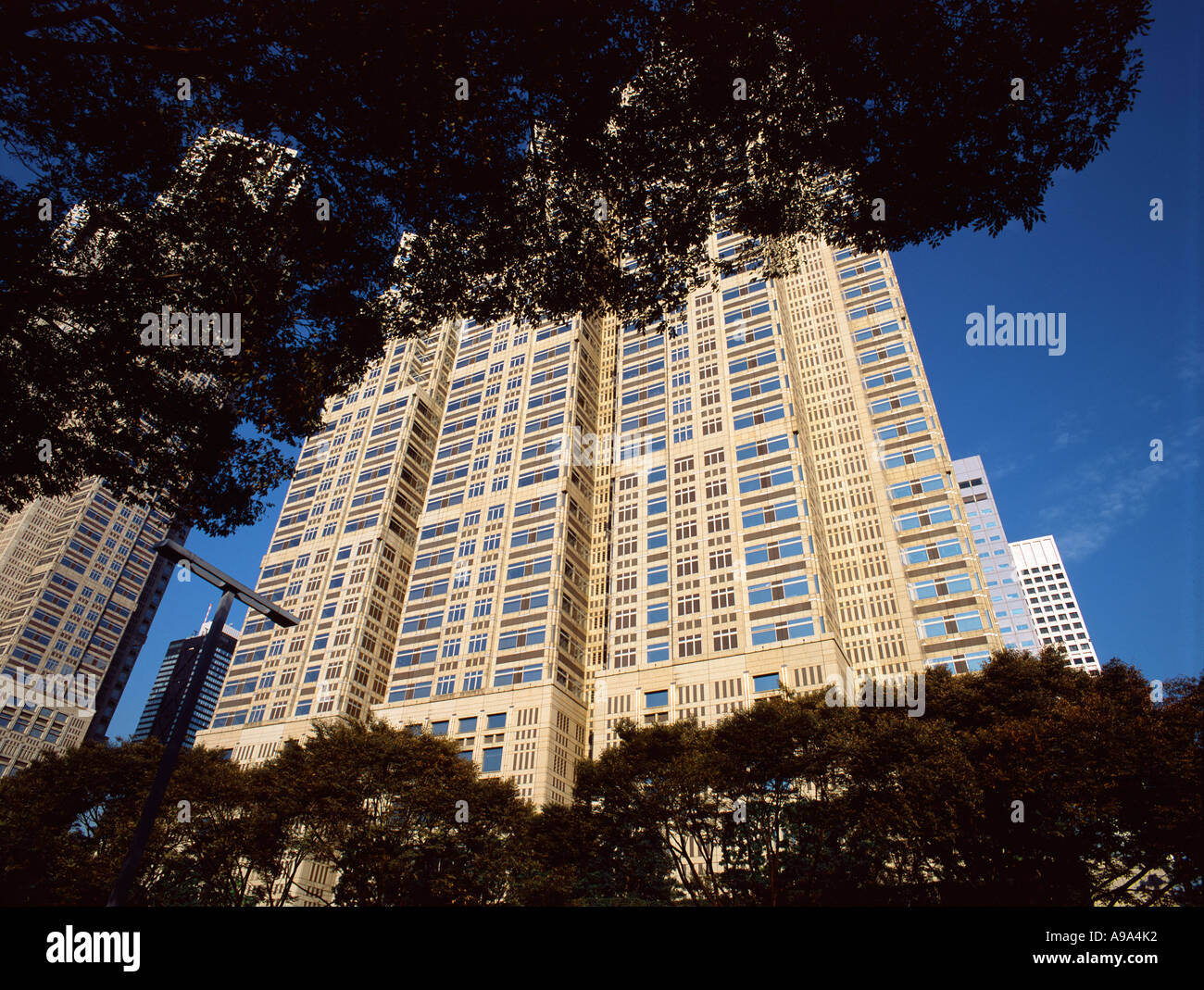 Wide angle shot of Tokyo municipal buildings seen through a gap between ...