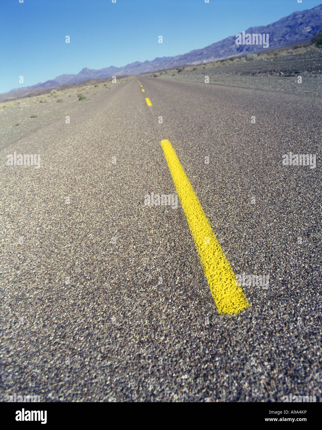 YELLOW CENTER LINE ON STRAIGHT ROAD ARIZONA USA Stock Photo - Alamy