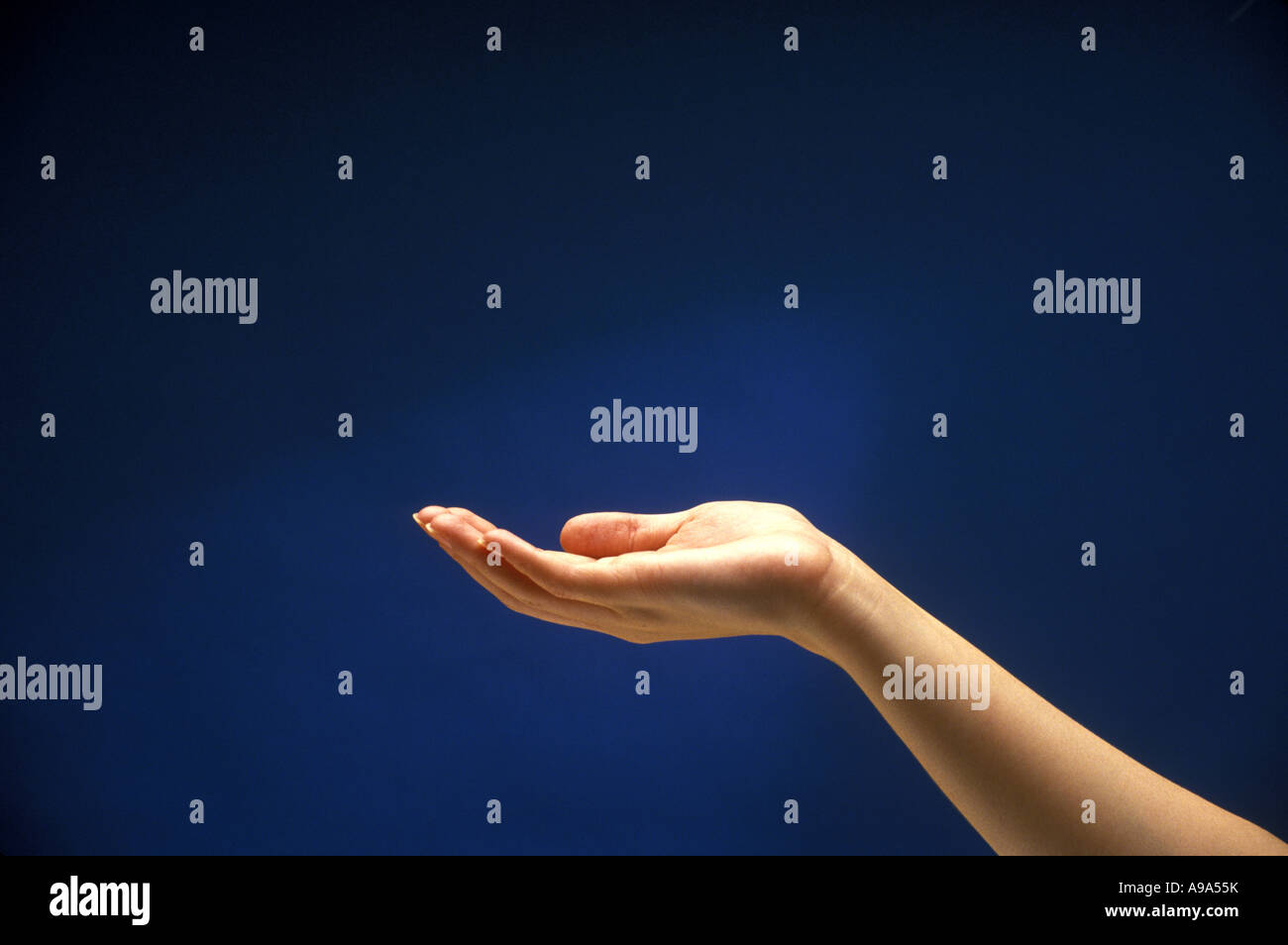 WOMANS ARM HAND WITH PALM UP Stock Photo - Alamy