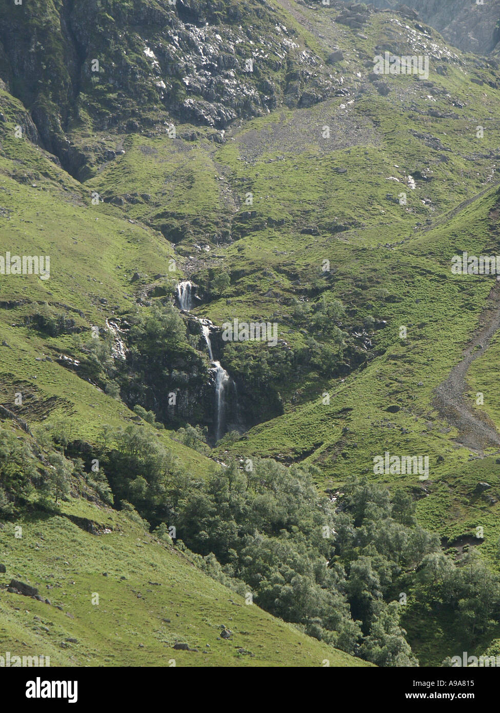 Waterfall flowing down hill side hi-res stock photography and images ...