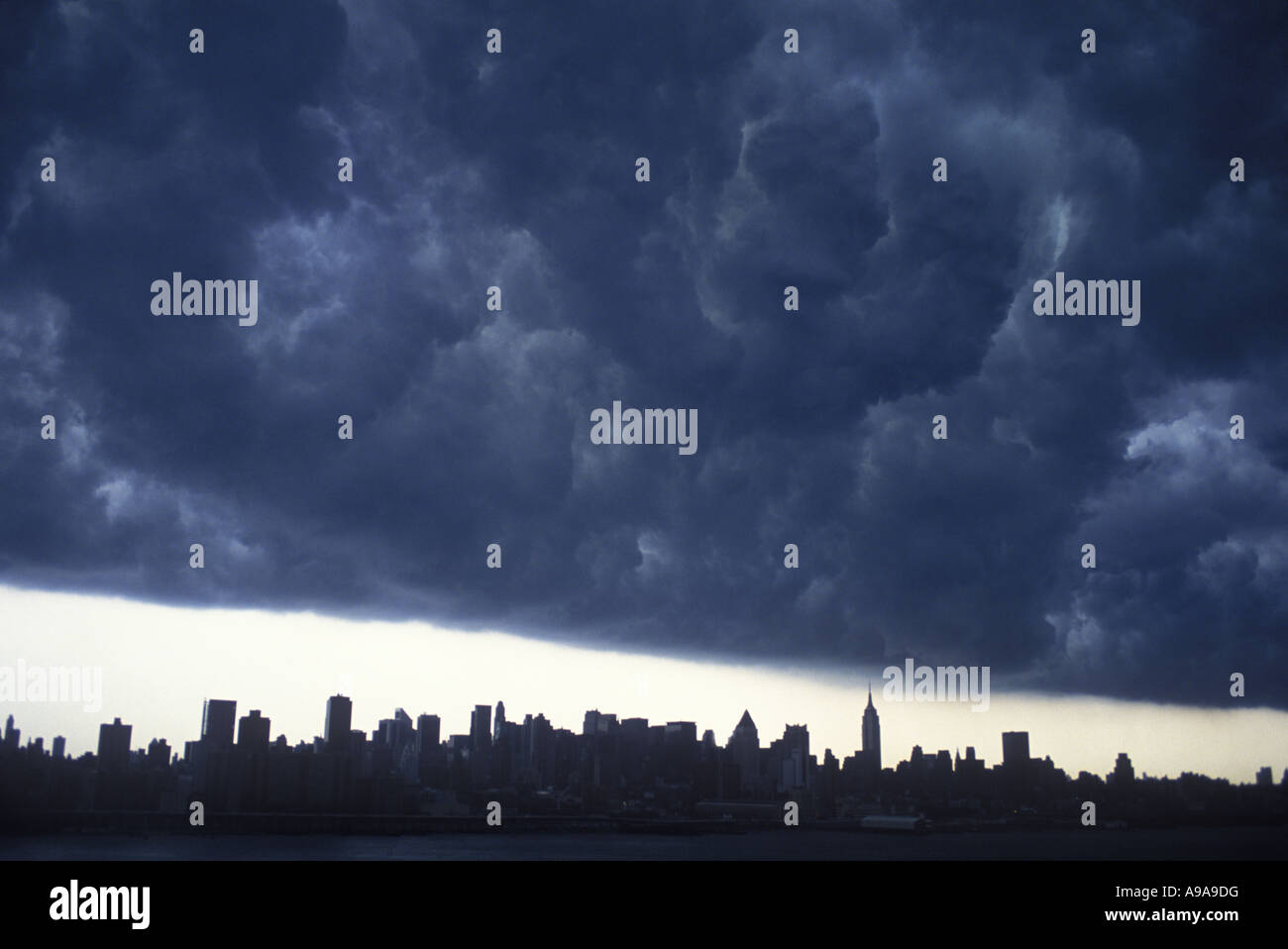 BLACK GRAY STORM CLOUDS OVER MIDTOWN SKYLINE MANHATTAN NEW YORK CITY ...