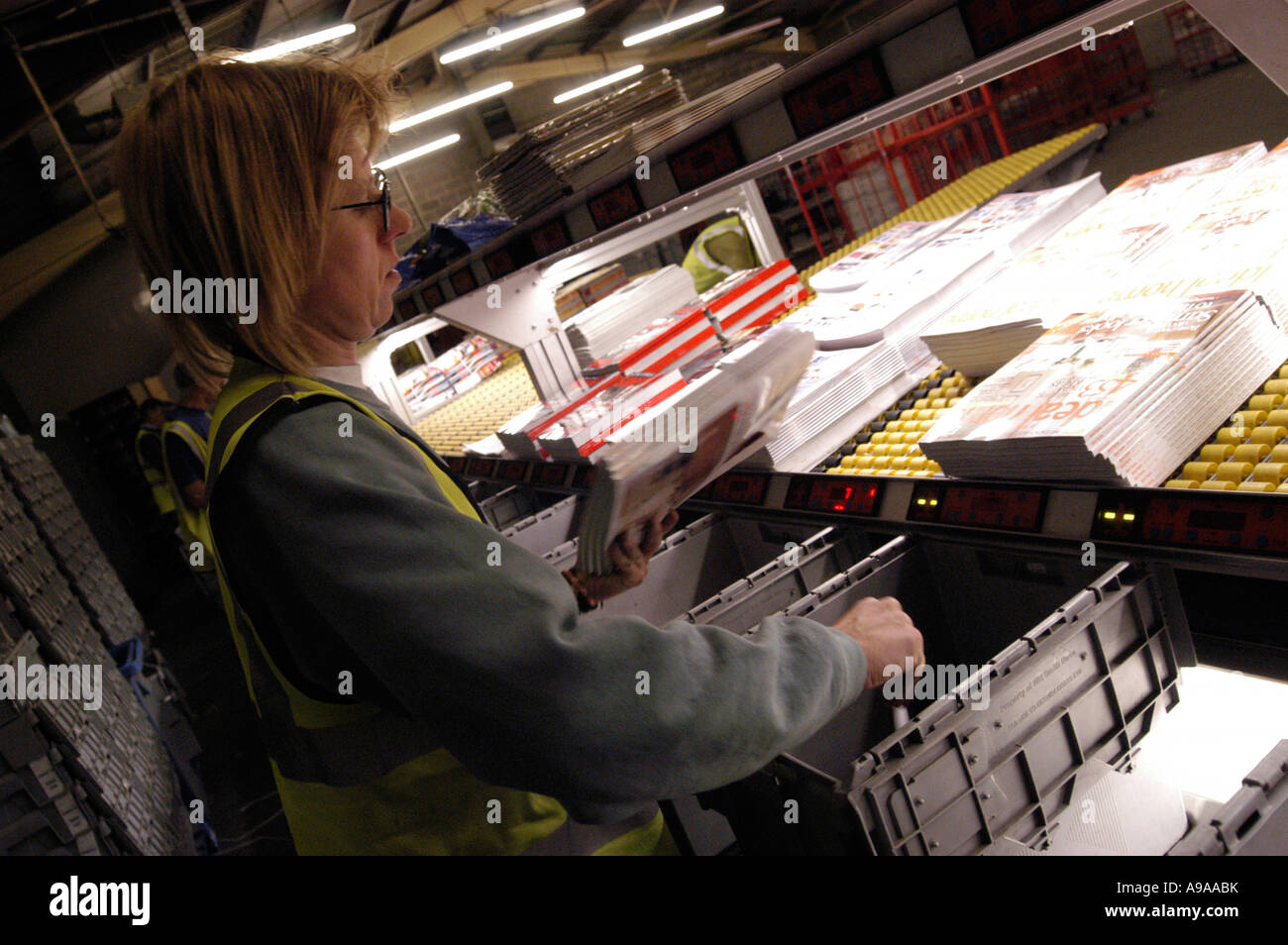 Sorting magazines before delivery Stock Photo - Alamy
