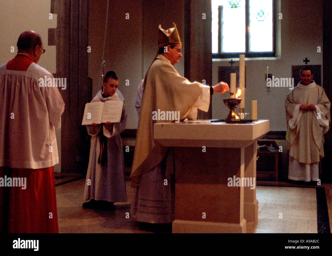 Bishop Tripp burns incense during the consecration of an altar Stock ...