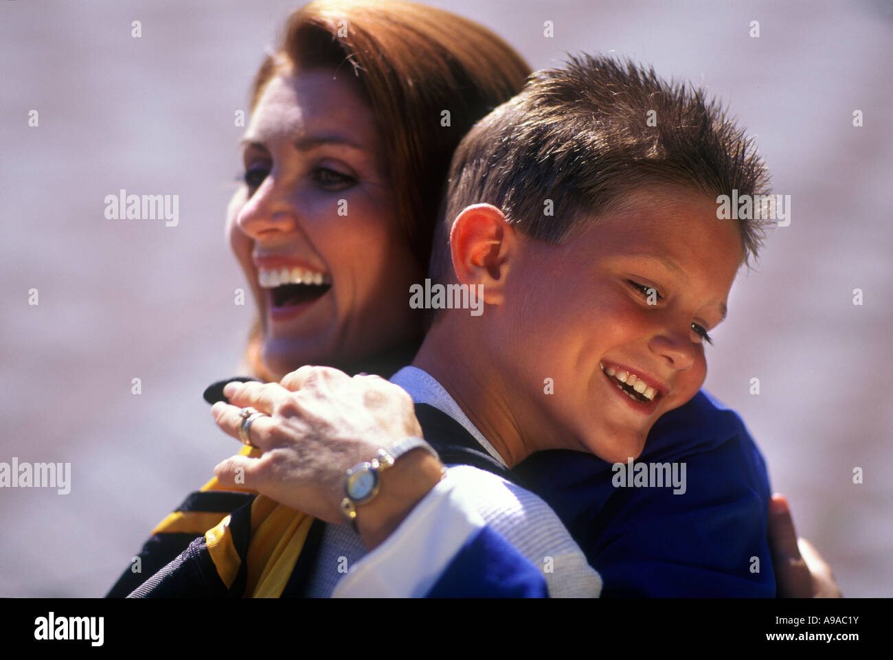 OFFICE WORKER HUGS CHILD Stock Photo - Alamy