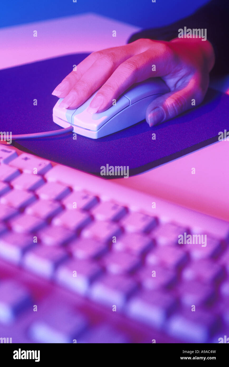 WOMANS HAND ON PERSONAL COMPUTER MOUSE AND KEYBOARD Stock Photo - Alamy