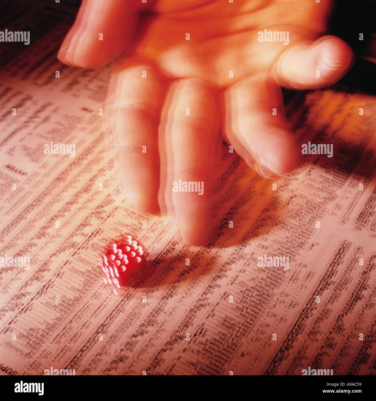Hand rolling dice hi-res stock photography and images - Alamy