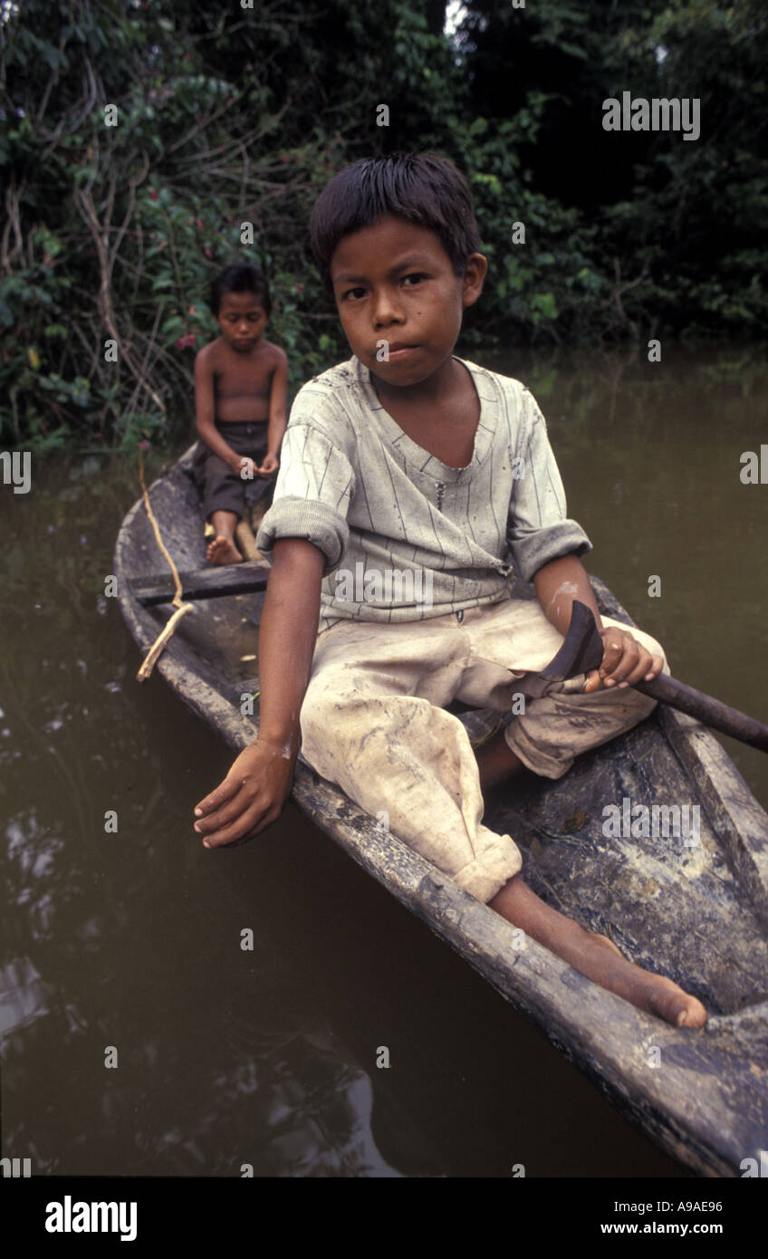 COLOMBIA Indian boys fishing from canoe in Amazonas Stock Photo - Alamy