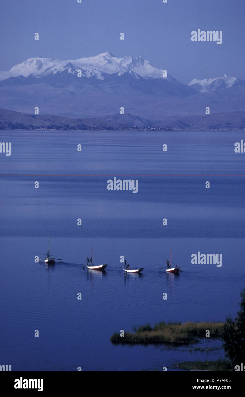 BOLIVIA Lake Titicaca fishing boats off Suriqui Island Cordillera Real ...