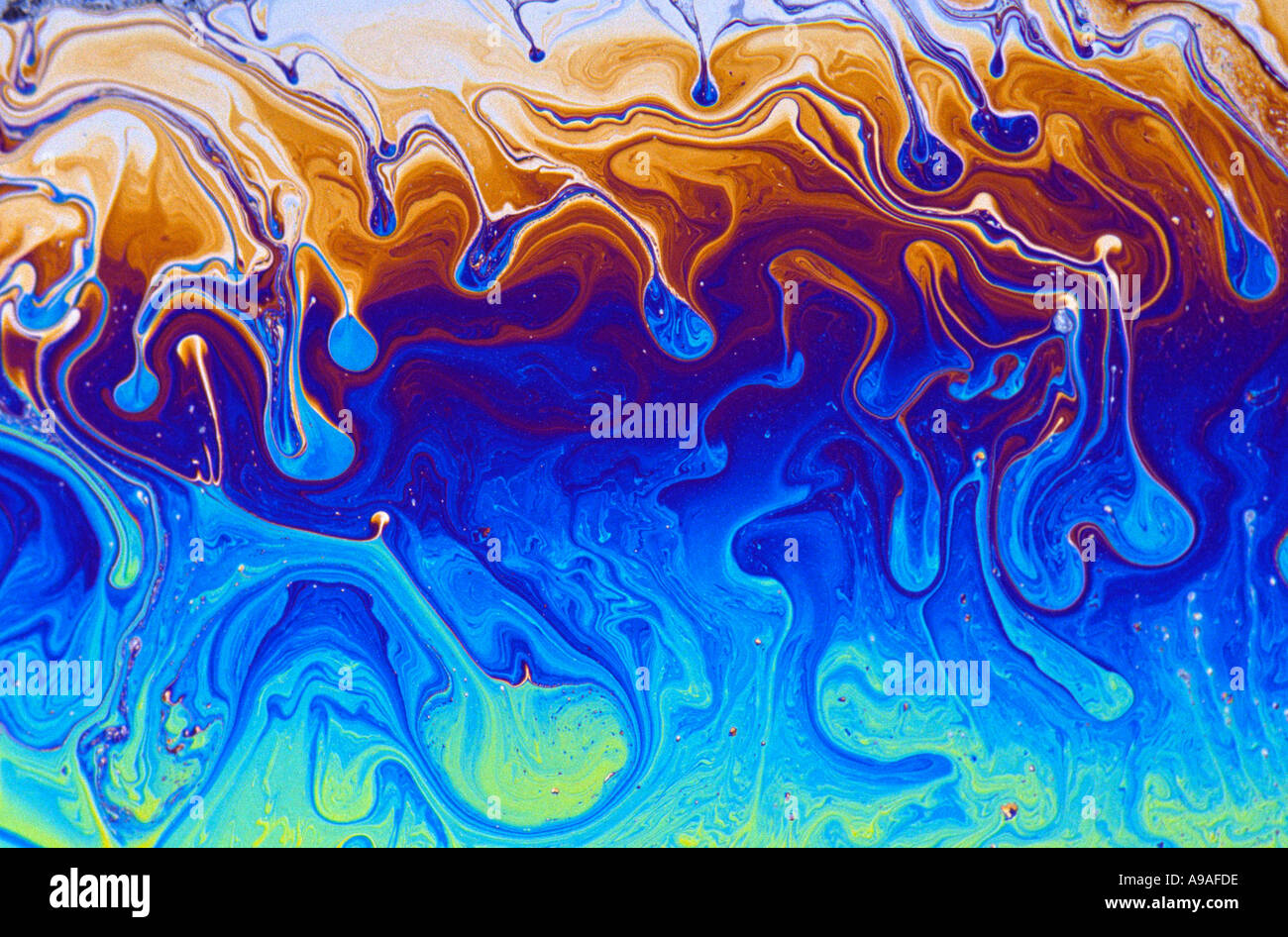 Abstract pattern in a soap film formed by the film of soap reflecting ...