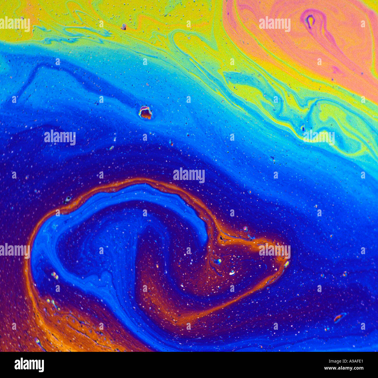 Abstract pattern in a soap film formed by the film of soap reflecting ...