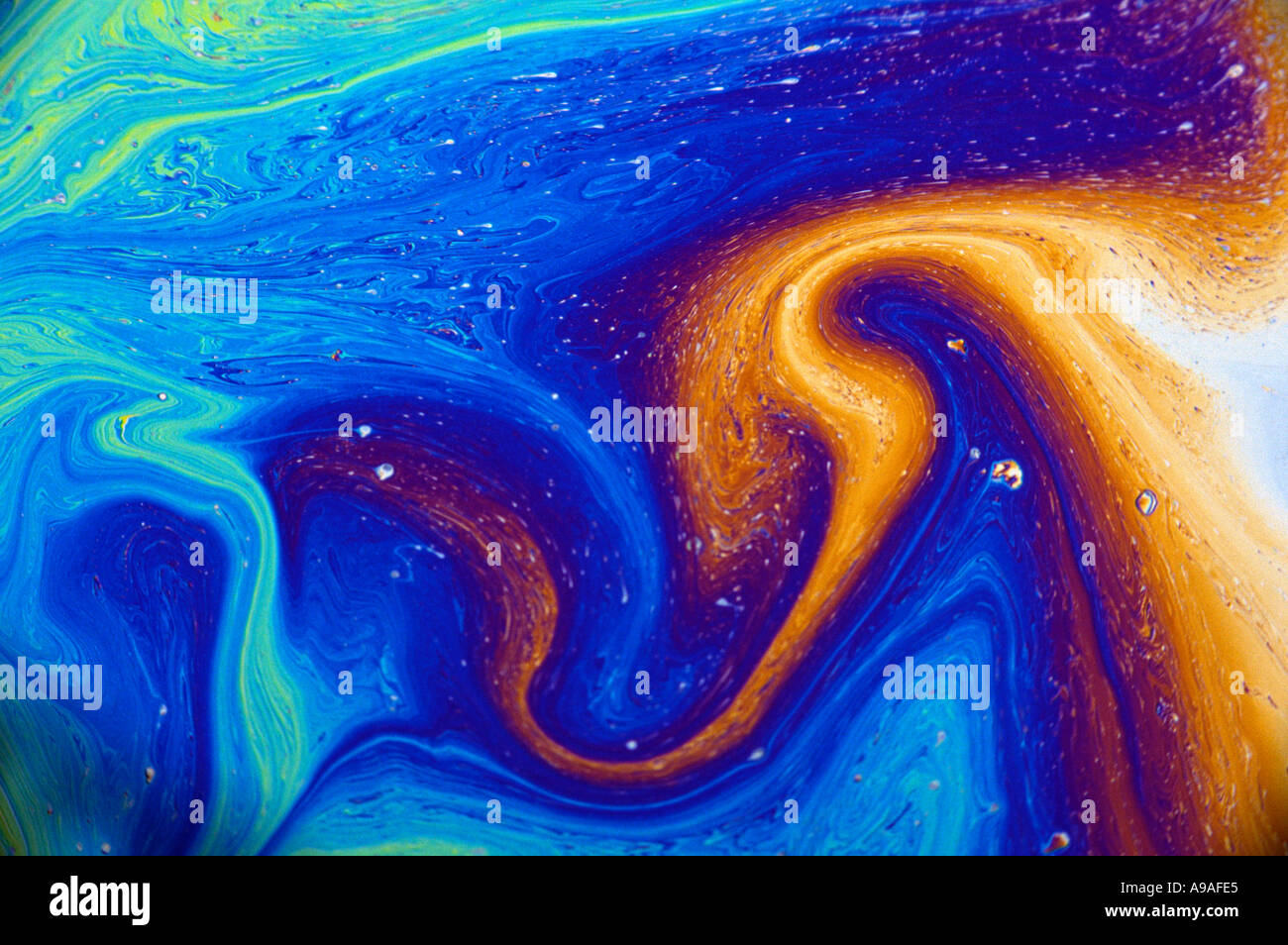 Abstract pattern in a soap film formed by the film of soap reflecting ...