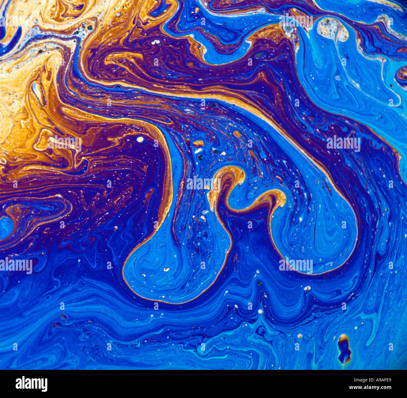 Abstract pattern in a soap film formed by the film of soap reflecting ...