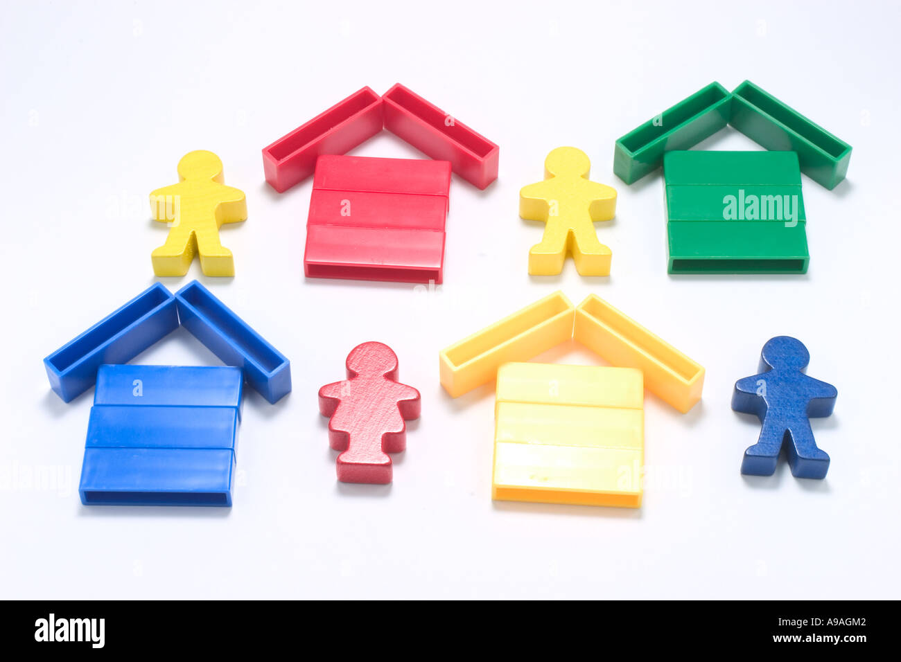 Wooden Figures and House Symbols Stock Photo - Alamy