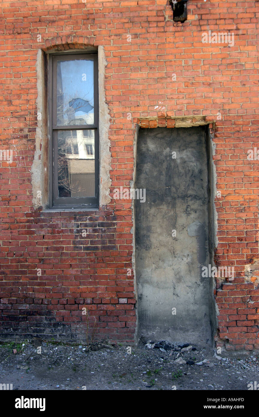 Brick building with door and window Stock Photo - Alamy