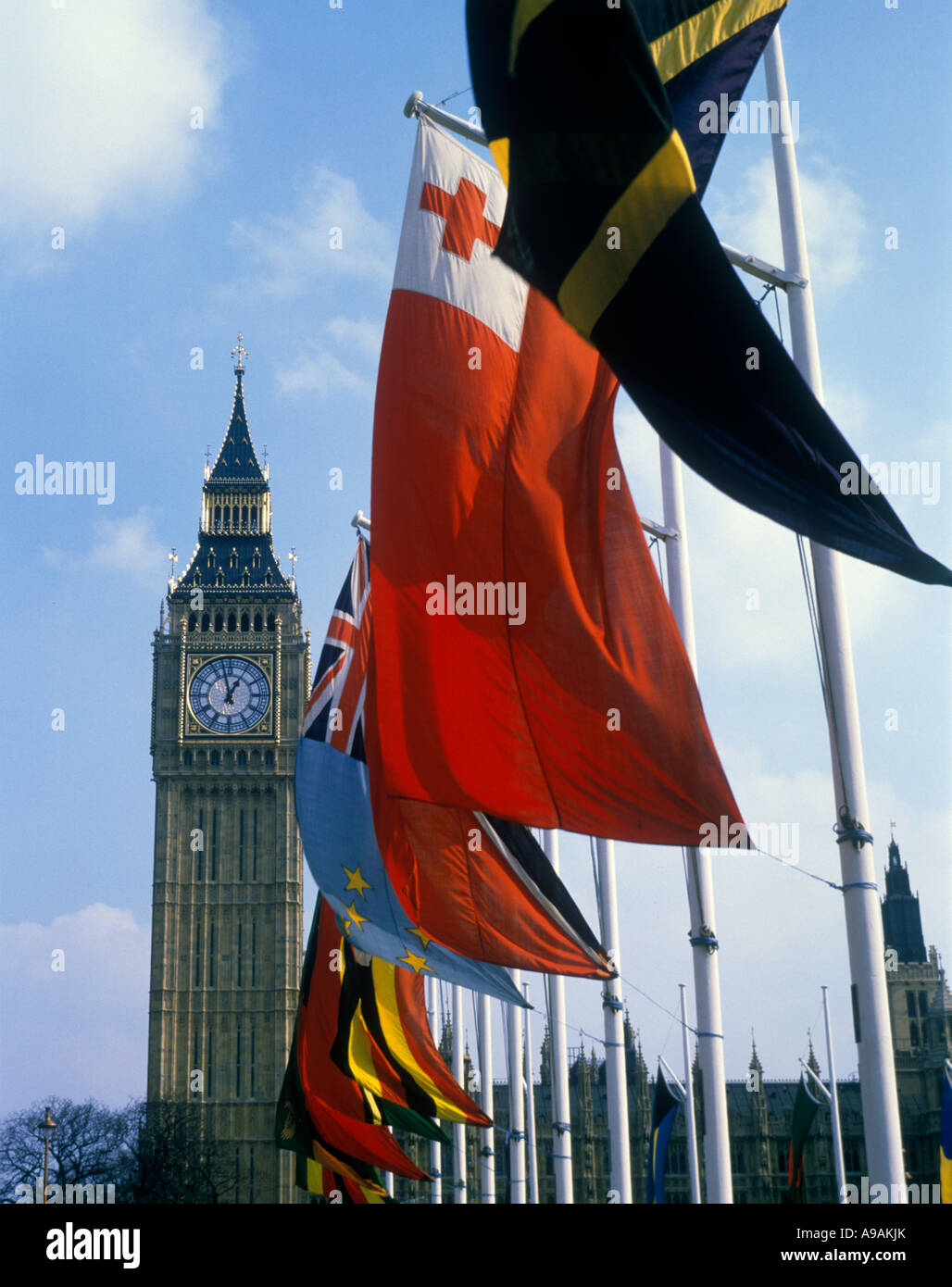 ROW OF NATIONAL FLAGS FLYING ON FLAGPOLES BIG BEN PARLIAMENT SQUARE ...