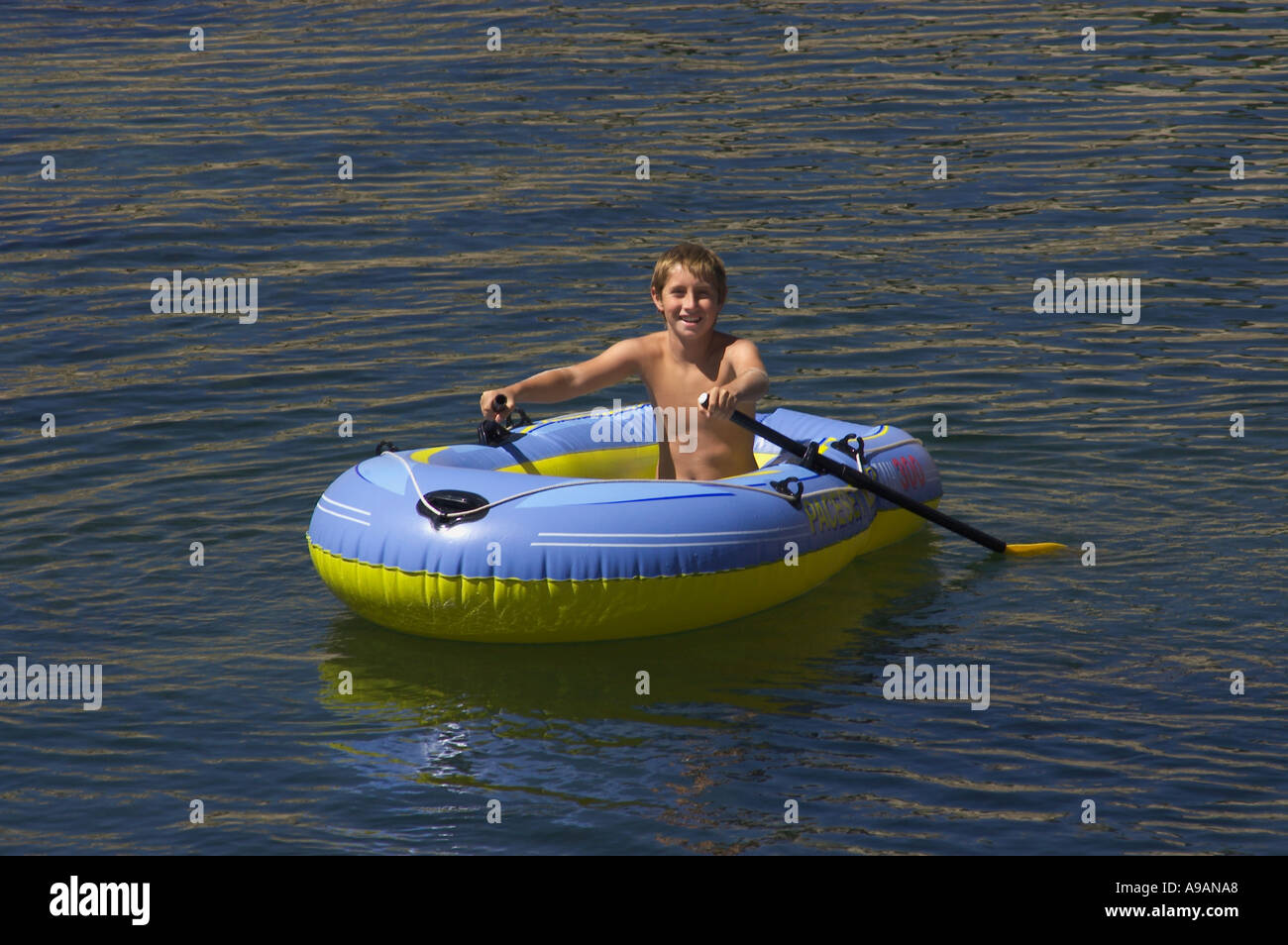 boy in boat CA Stock Photo - Alamy