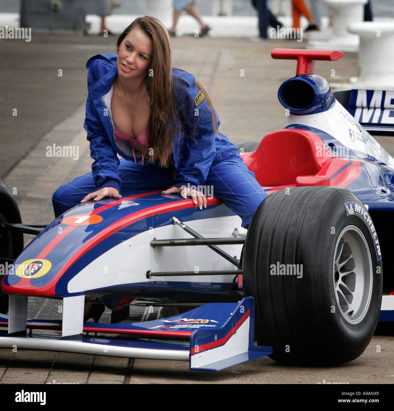 Racing Cars And Sex A Model Poses For Photographers On The Bonnet Of A